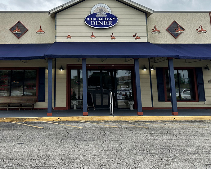 The blue awning beckons like a beacon of breakfast bliss in downtown Bartow's charming streetscape.