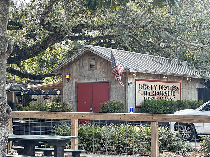 The unassuming exterior of Dewey Destin's Harborside&mdash;proof that the best seafood often hides in plain sight, like a delicious treasure waiting to be discovered.