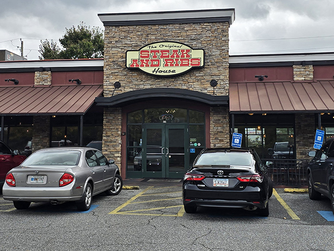 The stone facade says "casual," but that red sign promises serious business. Cartersville's meat temple beckons carnivores with unpretentious charm.