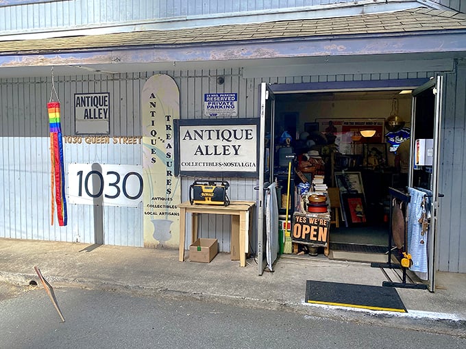 The unassuming exterior of Antique Alley on Queen Street might fool you, but that "YES WE'RE OPEN" sign is your portal to treasure-hunting paradise.