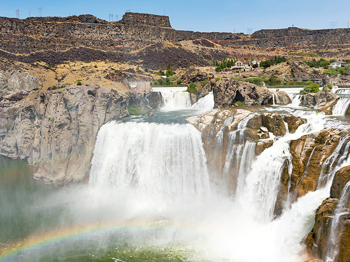 Nature's ultimate magic trick: 212 feet of thundering water creating rainbows on demand. Idaho's answer to Niagara, but with better parking.