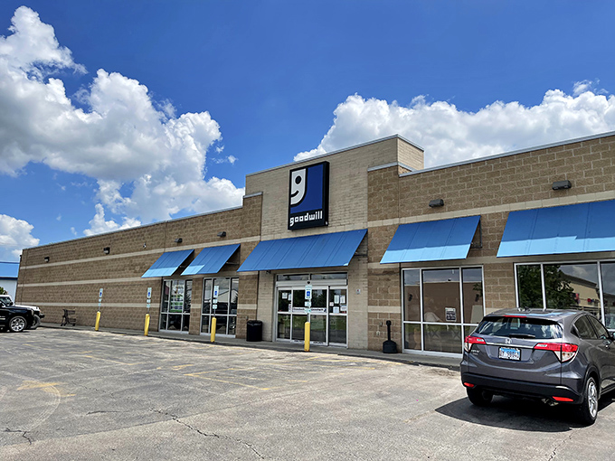 The iconic blue awnings of Goodwill stand out against the beige building like a bargain-hunter's North Star. On clear days, even the clouds seem to gather for a peek at what treasures await inside.