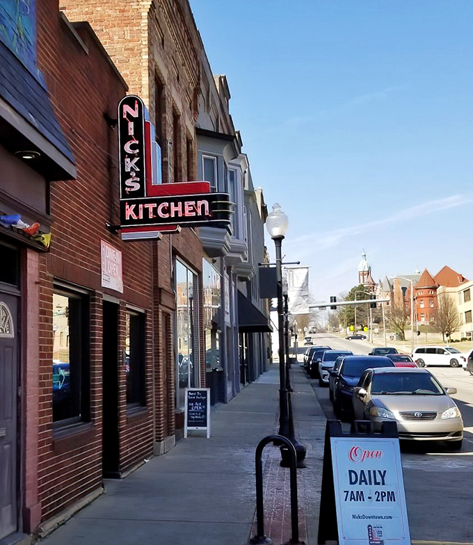 That vintage neon sign isn't just advertising; it's a beacon calling tenderloin pilgrims home to downtown Huntington.