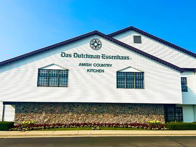 The white clapboard exterior of Das Dutchman Essenhaus stands proudly against the blue sky, like Indiana's answer to comfort food heaven.