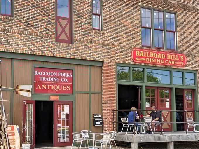 The brick facade of Railroad Bill's Dining Car stands proudly in Des Moines, where breakfast dreams come true and outdoor seating beckons hungry travelers.