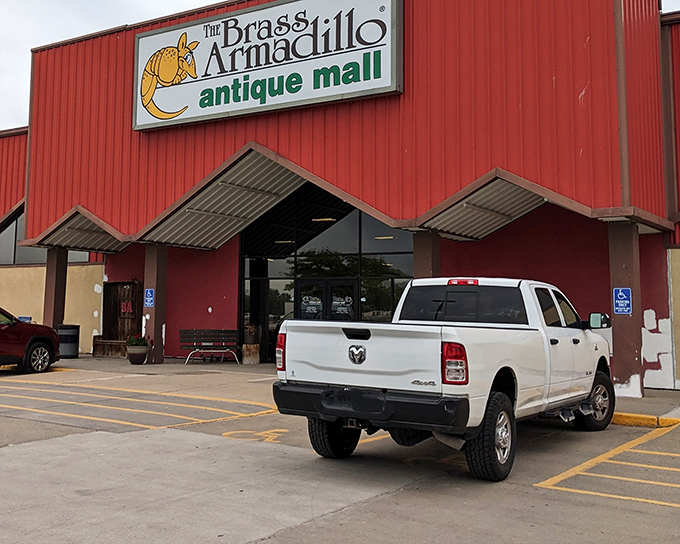 The bright red exterior of Brass Armadillo stands like a beacon of nostalgia, promising treasure hunters the thrill of discovery behind those welcoming doors.