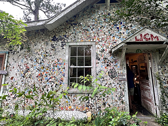 The Abita Mystery House's exterior is a mosaic masterpiece, where broken pottery transforms an ordinary building into extraordinary art.