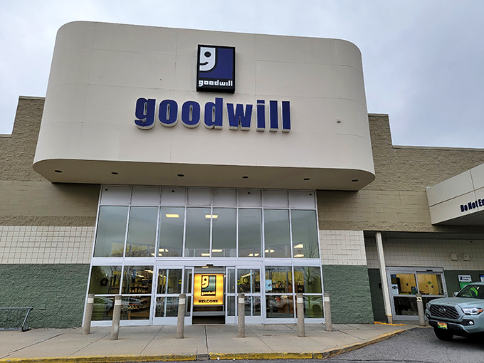 The iconic blue smile logo beckons like a lighthouse for bargain hunters. South Portland's Goodwill stands ready to transform one person's castoffs into another's treasures.