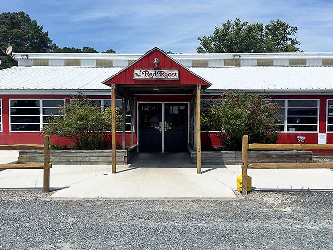The bright red exterior of The Red Roost stands like a culinary lighthouse in rural Quantico, beckoning hungry travelers from miles around.