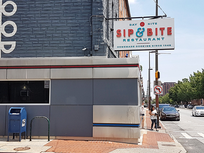 The iconic Sip & Bite sign stands as a beacon of breakfast hope on Baltimore's streets, promising homemade comfort since 1948.