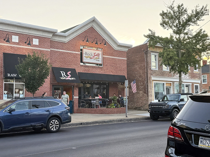The brick facade of RockSalt Grille stands proudly on Westminster's Main Street, its welcoming patio beckoning seafood lovers like a siren's call to hungry sailors.