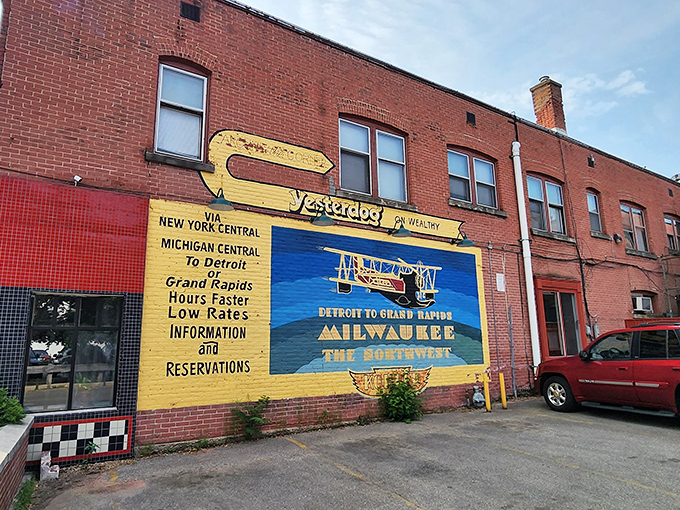 The iconic exterior mural of Yesterdog stands as a colorful time capsule, promising rail journeys and hot dog adventures in equal measure.