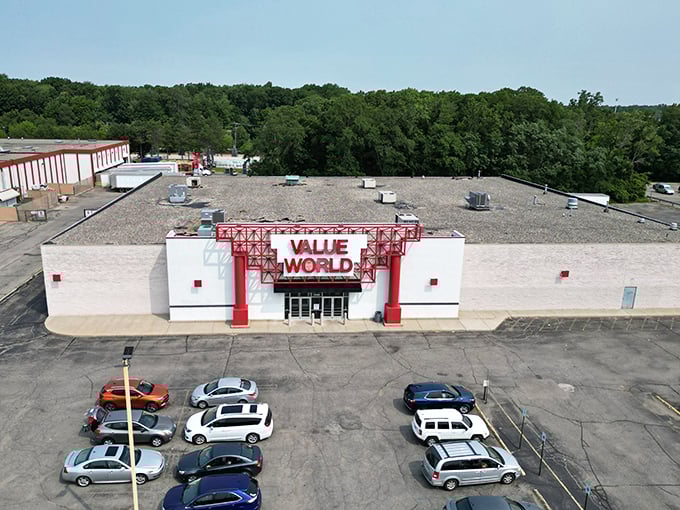The unmistakable red signage of Value World stands like a beacon of bargain hope against Michigan's sky, promising treasure hunters their next great find.