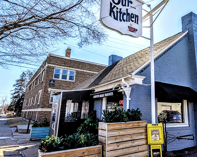 The iconic Our Kitchen sign beckons like a lighthouse for breakfast sailors. This unassuming white brick building houses Minneapolis breakfast magic.