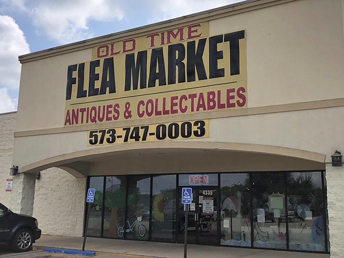 Blue skies frame this vintage hunter's paradise, where "Antiques & Collectibles" isn't just a sign &ndash; it's a promise of adventures waiting inside.
