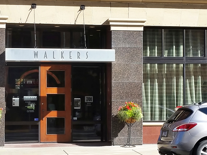The warm wooden door and sleek stone facade of Walkers beckons like a culinary lighthouse in downtown Billings, promising delicious refuge from Montana's elements.