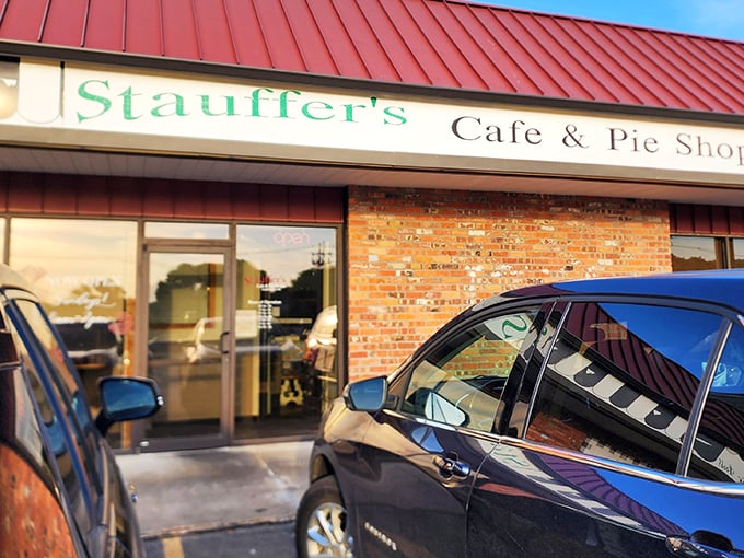 The iconic red roof of Stauffer's Cafe & Pie Shoppe beckons hungry travelers like a lighthouse guiding ships to delicious harbor.