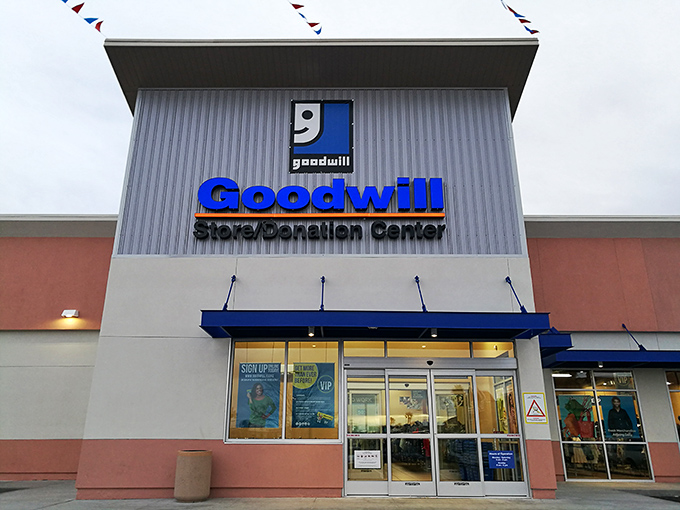 The blue Goodwill sign beckons like a lighthouse to bargain hunters. This Henderson location promises treasure behind those automatic doors.