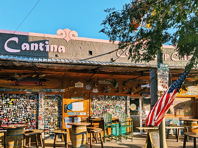 The iconic facade of The Coffee Cup Cafe, where stickers tell stories and barrel seating invites you to linger under the Nevada sun.