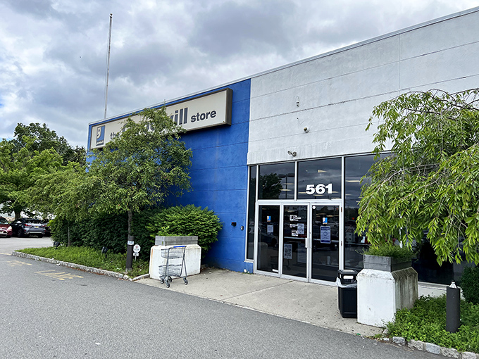 The blue-and-white facade of Goodwill Pompton Plains stands like a beacon for bargain hunters. Behind these doors, retail adventures await!