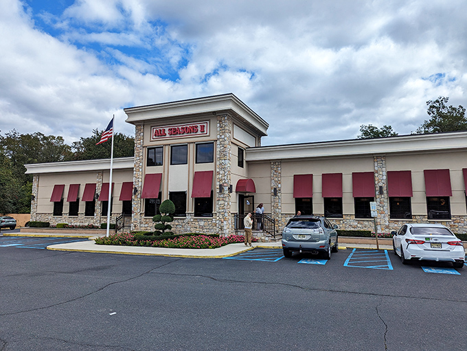 The stone facade and vibrant red awnings of All Seasons Diner II stand as a beacon of breakfast hope along Route 9. Classic Jersey diner architecture at its finest.