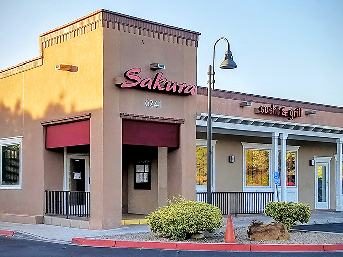 The unassuming exterior of Sakura Sushi & Grill proves once again that culinary treasures often hide in plain sight. That neon "OPEN" sign is practically winking at you.
