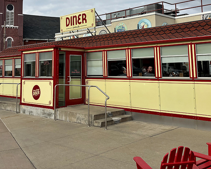 The bright yellow exterior of Swan Street Diner feels like a step back in time, while the red trim adds a playful wink to its retro charm.