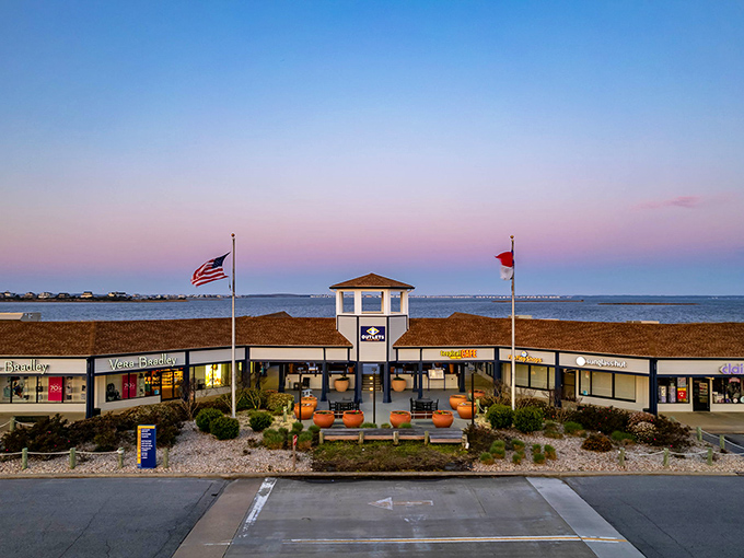 That picturesque sunset view behind the outlet mall proves even shopping centers get the good lighting treatment sometimes.