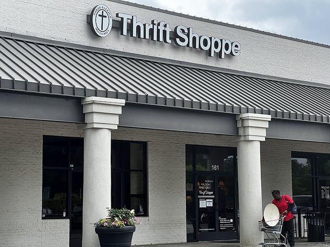 The unassuming storefront of North Raleigh Ministries Thrift Shoppe&mdash;where bargain hunters find treasures hiding in plain sight beneath that classic strip mall awning.