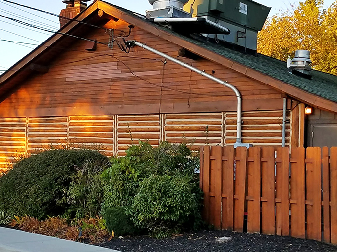 As dusk settles, this woodland steakhouse glows with promise, like a beacon for hungry travelers seeking carnivorous nirvana.