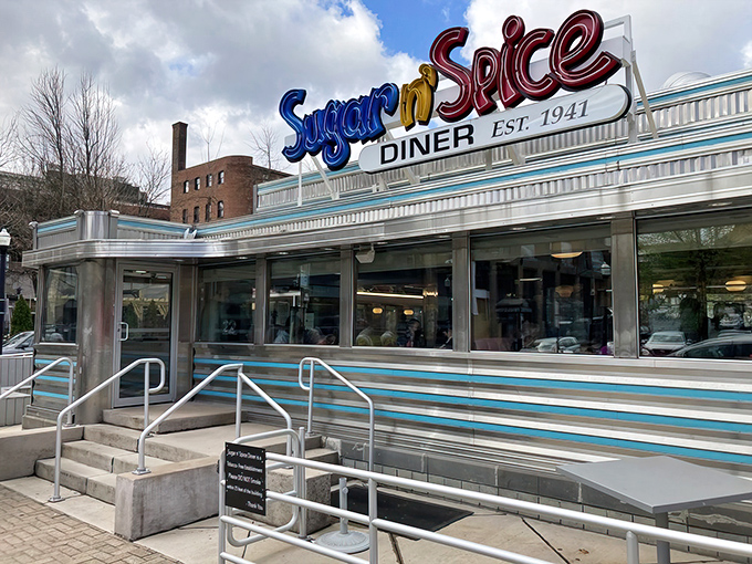 By night, Sugar n' Spice transforms into a pink-hued beacon of hope for the breakfast-deprived. The diner glows like a delicious mirage in the urban landscape.