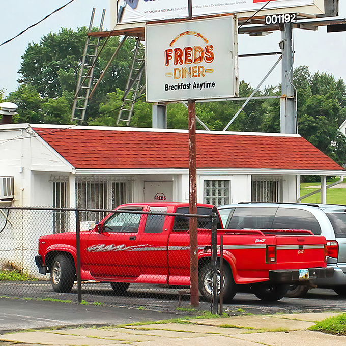 The iconic red-roofed Fred's Diner stands proudly in Akron, promising "Breakfast Anytime" – words that warm the soul like a perfectly toasted piece of bread.