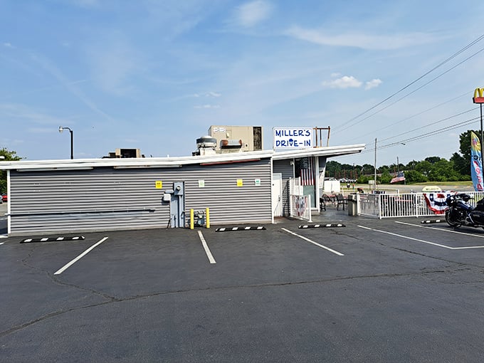 The unassuming exterior of Miller's Drive-In belies the culinary treasures within. Small-town charm with big-time flavor awaits behind those gray walls.