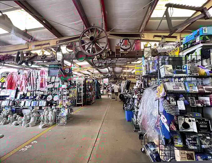 The treasure hunter's paradise awaits! Antique wagon wheels and farm implements dangle from the ceiling while aisles stretch endlessly with possibilities below.