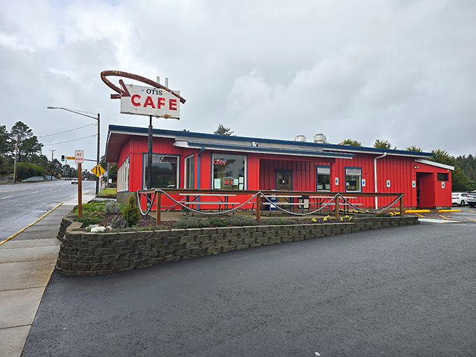 The iconic red exterior of Otis Cafe stands like a beacon for hungry travelers, promising comfort food salvation just off Highway 18.
