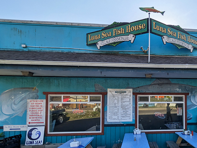 The iconic turquoise exterior of Luna Sea Fish House stands out like a maritime beacon, complete with a fish weathervane that seems to point toward deliciousness.
