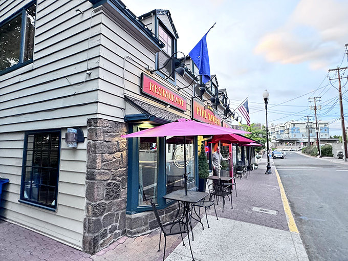 The Pine Tavern's charming exterior beckons with its classic facade and iconic red awning, a Bend landmark waiting to be discovered.