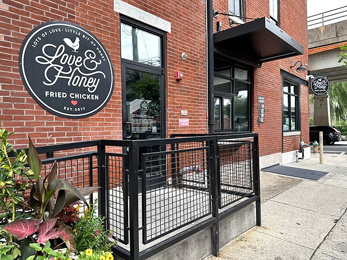 The brick-and-mortar temple of fried chicken perfection beckons with its simple black sign—a siren call to comfort food seekers throughout Pennsylvania.
