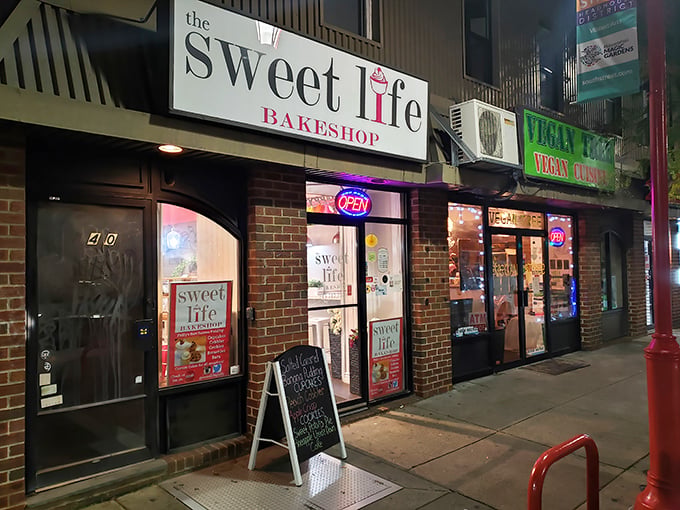 The Sweet Life Bakeshop's unassuming brick exterior hides dessert treasures that would make Willy Wonka jealous. Philadelphia's best-kept secret glows invitingly at night.