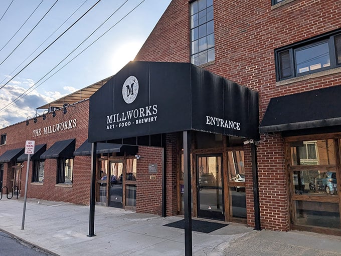 The brick facade of The Millworks stands like a culinary fortress in Harrisburg, promising delicious adventures within its historic walls.