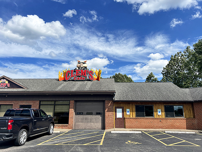 The unmistakable Clem's Cafe sign, complete with sunglasses-wearing pig mascot, promises smoky delights within. Hardwood BBQ never looked so inviting against the Pennsylvania sky.