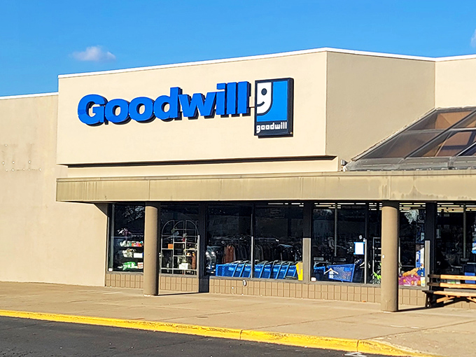 Blue signage beckons bargain hunters like a retail lighthouse, guiding thrifty shoppers safely to shore through seas of full-price temptation.