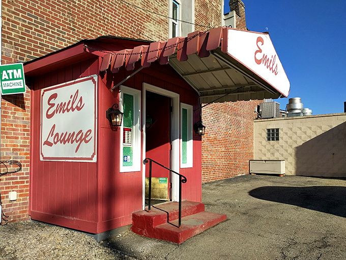 The unassuming entrance to Emil's Lounge stands like a culinary time capsule, promising treasures that chain restaurants can only dream about.