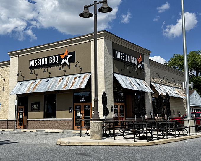 That corrugated metal awning isn't just for show&mdash;it's preparing you for the smoky goodness waiting inside this patriotic barbecue paradise.