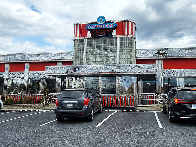 Under blue skies, this stainless steel time machine beckons with promises of perfect hash browns and conversations that flow as freely as the coffee.