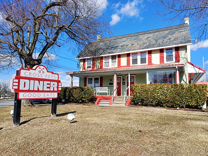 The red and white farmhouse-turned-diner stands proudly against the Pennsylvania sky, its vintage sign promising "GOOD EATS" &ndash; a promise it definitely keeps.
