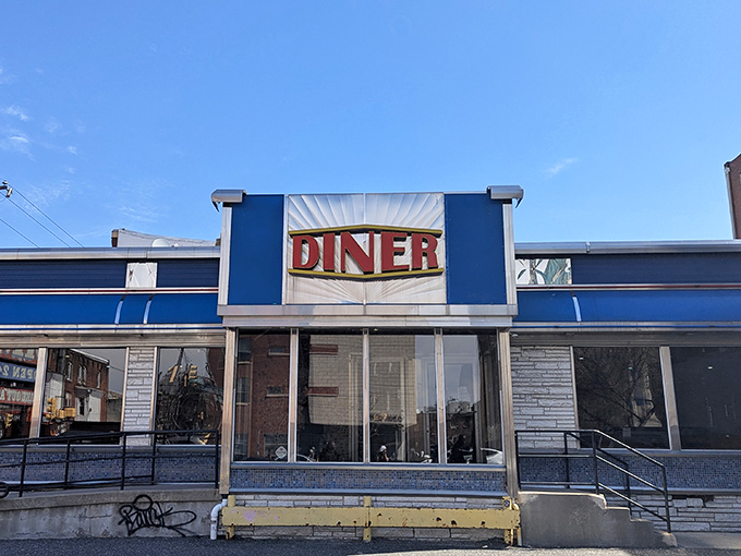 That iconic blue-and-white facade practically glows with the promise of breakfast perfection waiting inside for hungry souls.