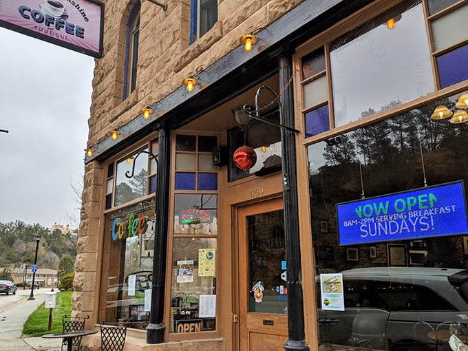The historic sandstone fa&ccedil;ade says "respectable establishment," but those vibrant coffee banners scream "caffeine sanctuary for the desperate and devoted!"