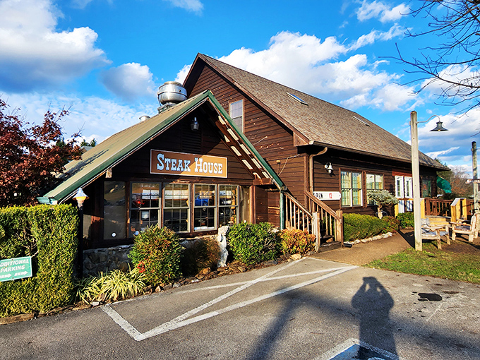 The rustic log cabin exterior of Trailhead Steak & Trout House promises what every great meal should: honest food without pretension. Mountain charm at its finest.
