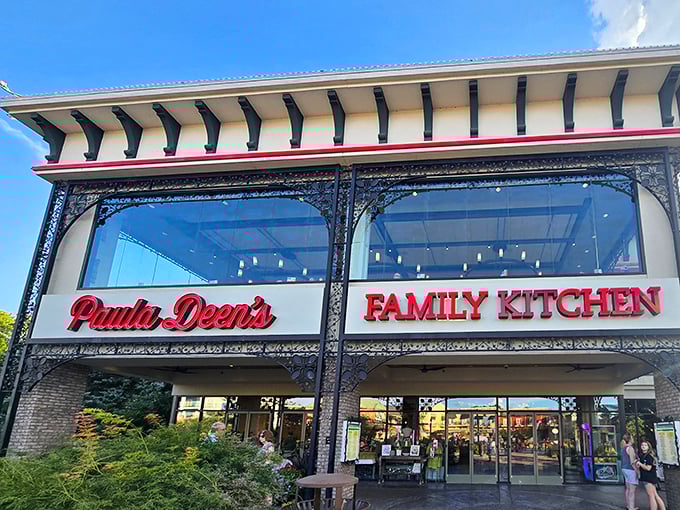 The gleaming facade of Paula Deen's Family Kitchen stands like a beacon of butter-based hope in Pigeon Forge's Island entertainment complex.